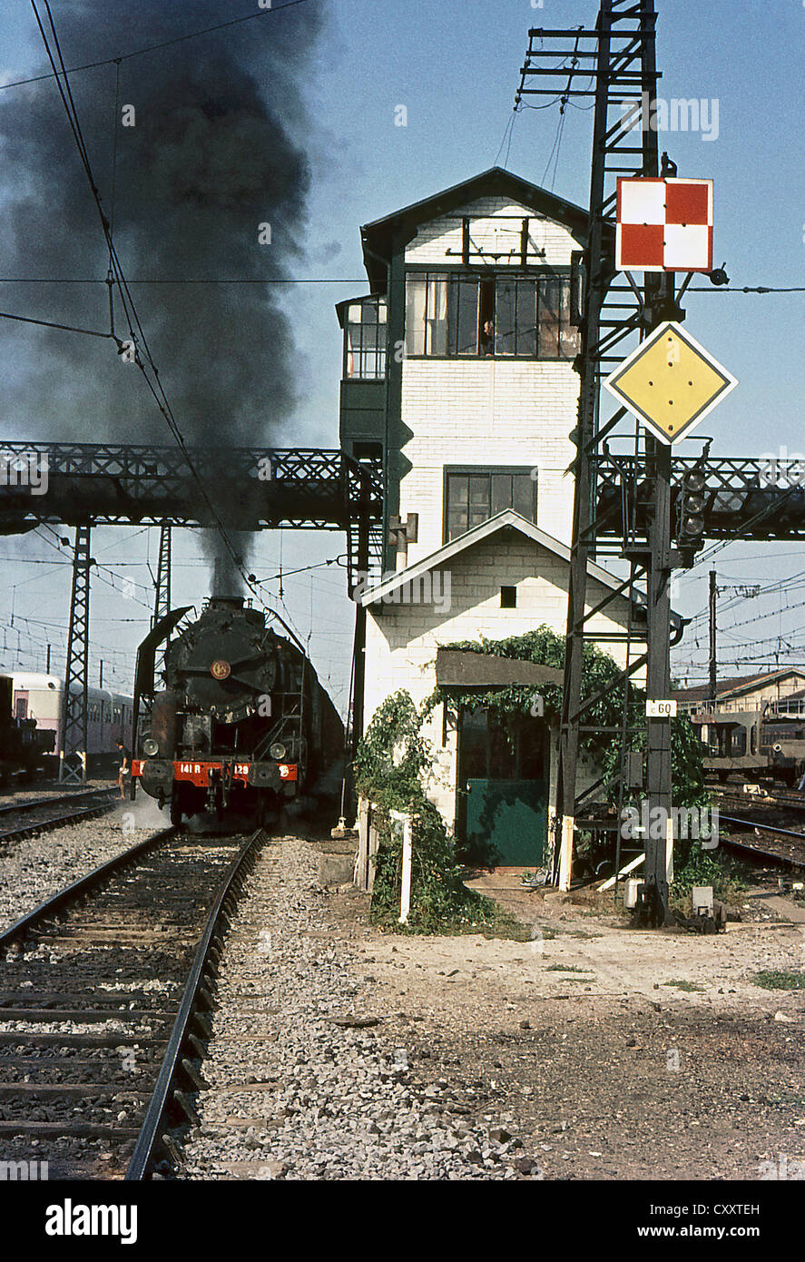 One of the last remaining French SNCF 141R 2-8-2s pulls heavily away ...