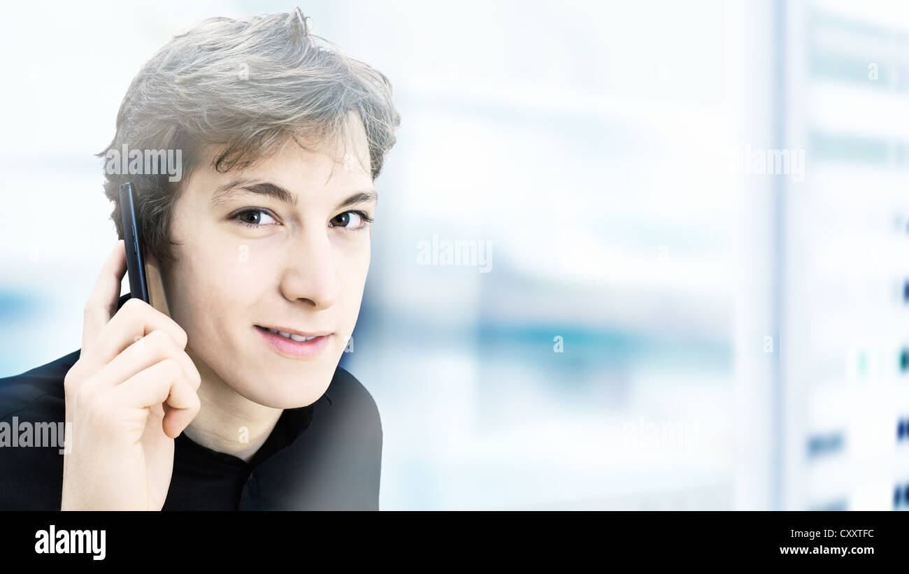 Young businessman, speaking on a mobile phone Stock Photo - Alamy