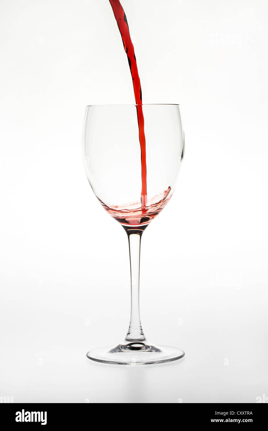 Red wine is filled in a glass Stock Photo - Alamy