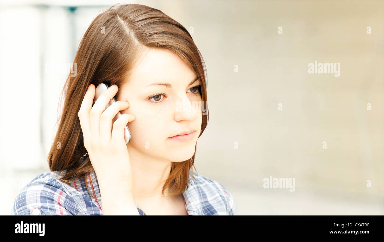 Girl speaking on a mobile phone Stock Photo - Alamy