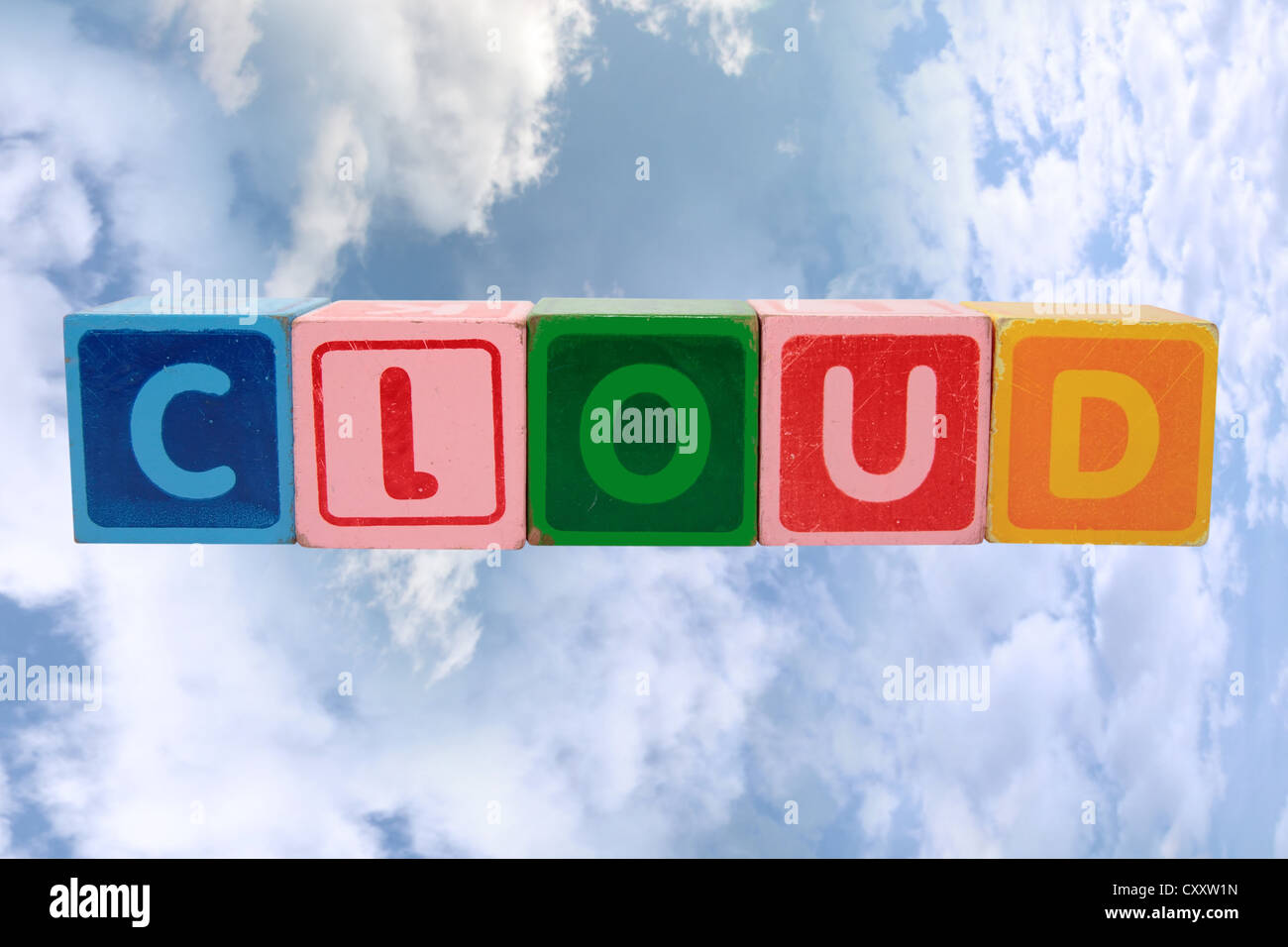 toy letters that spell cloud against a cloudy background with clipping ...