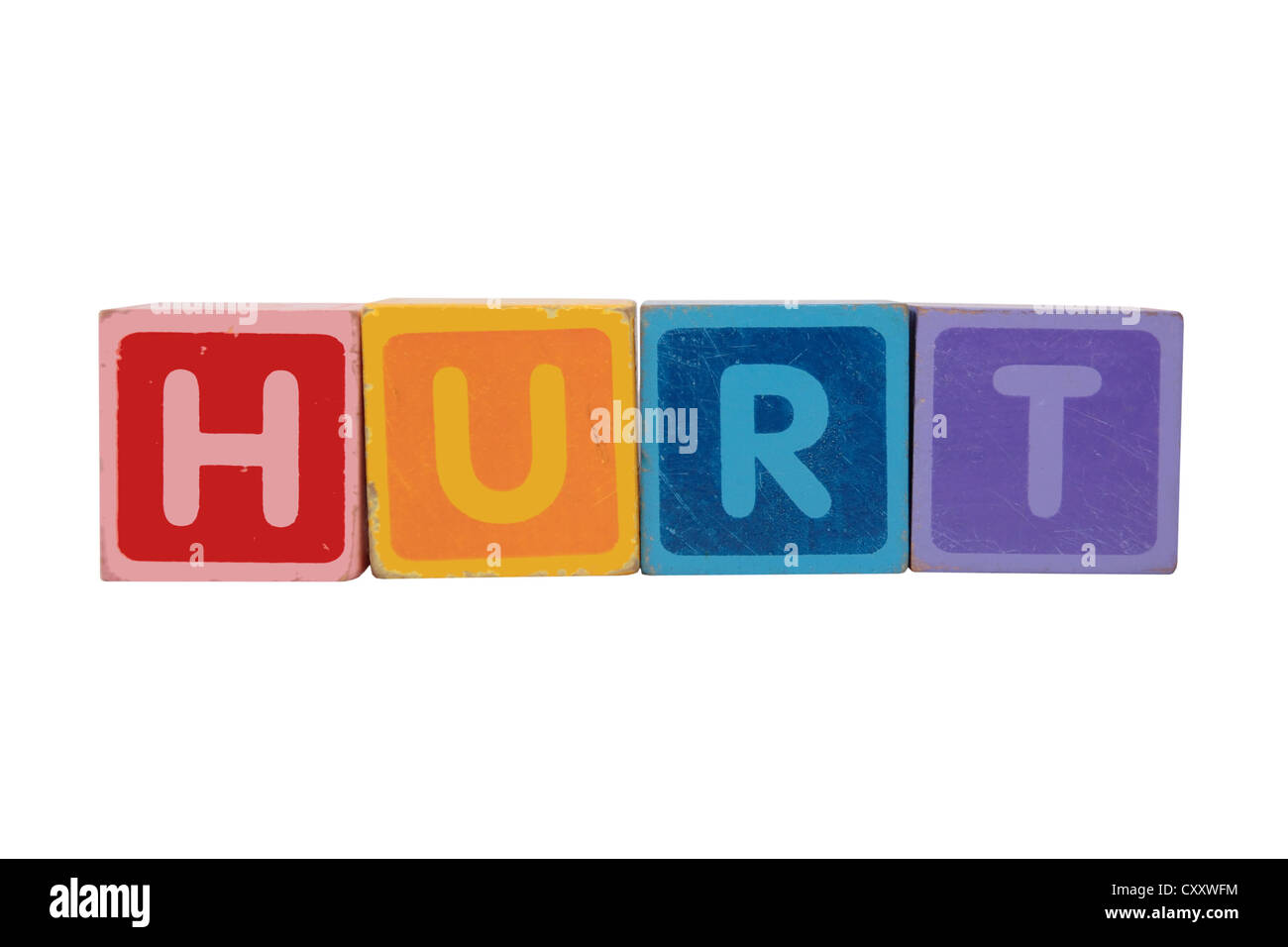 toy letters that spell hurt against a white background with clipping ...