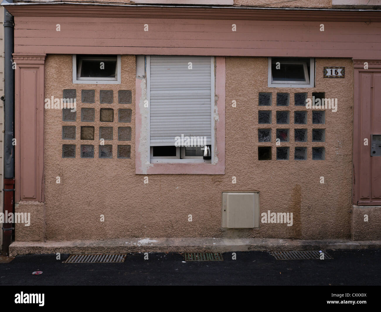 A shutter blind kept open by an electric kettle used as a prop Stock ...