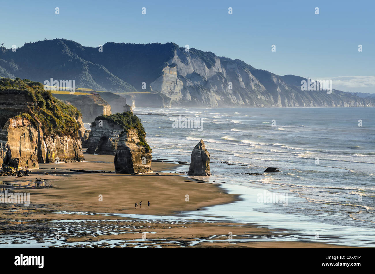 White Cliffs Beach at low tide, rocks in the surf, Ahititi, Taranaki ...
