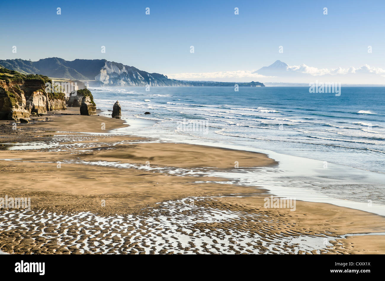White Cliffs Beach at low tide, Mt. Tarakaki volcano on the horizon ...