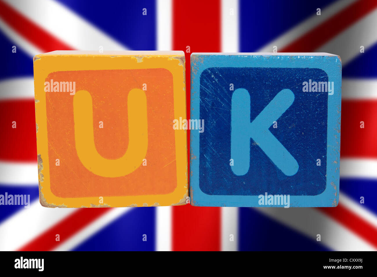 toy letters that spell UK against a flag background with clipping path ...