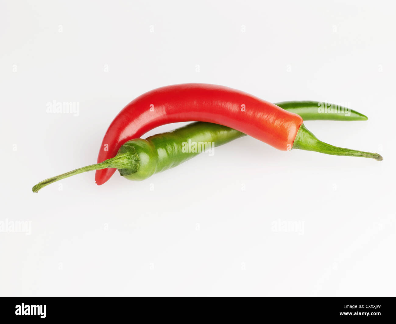 Red and green pepperoni on white background Stock Photo - Alamy