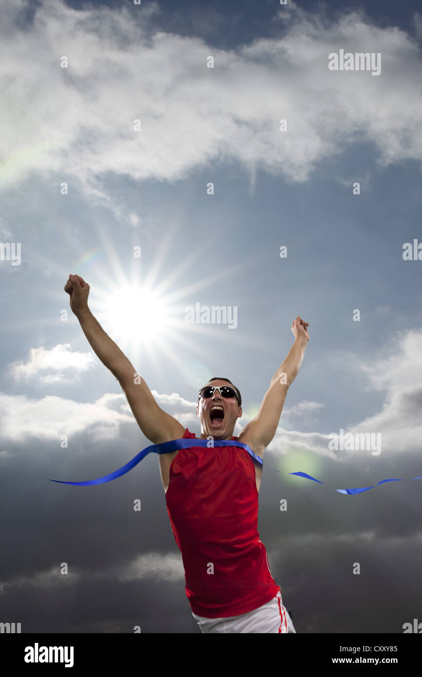 Runner, triumph, finish line, cheering Stock Photo - Alamy