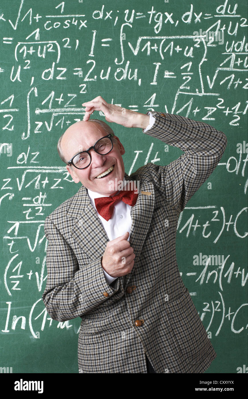 Professor, teacher, blackboard, mathematic formulas, equations ...