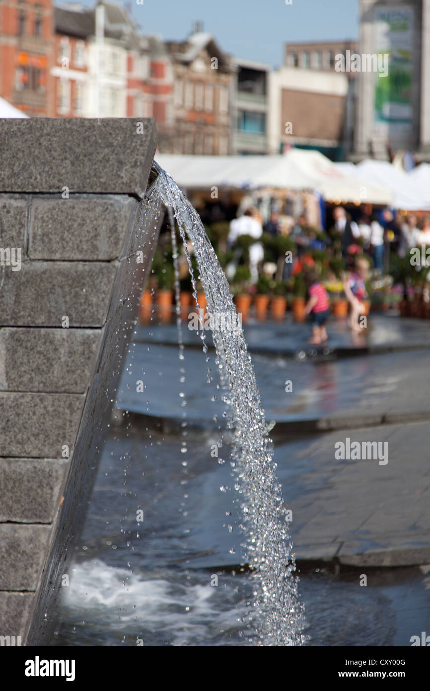 Civic waterfall with market stall behind Stock Photo - Alamy