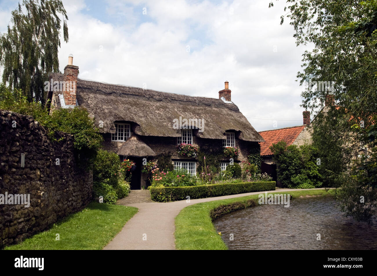 cottage on the river Stock Photo - Alamy