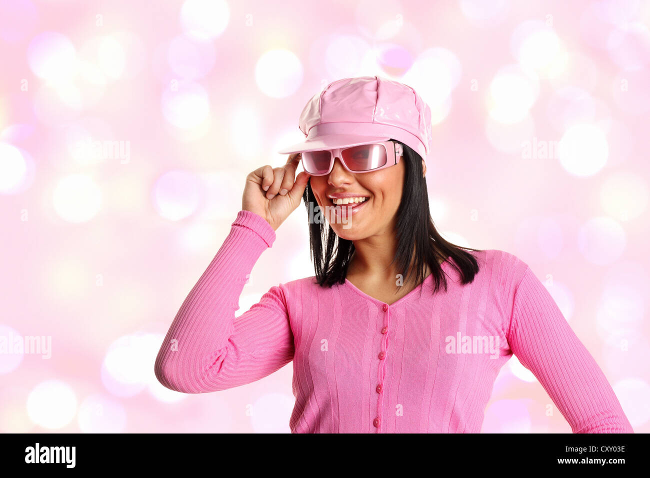 Person wearing cap pink glasses hi-res stock photography and images - Alamy