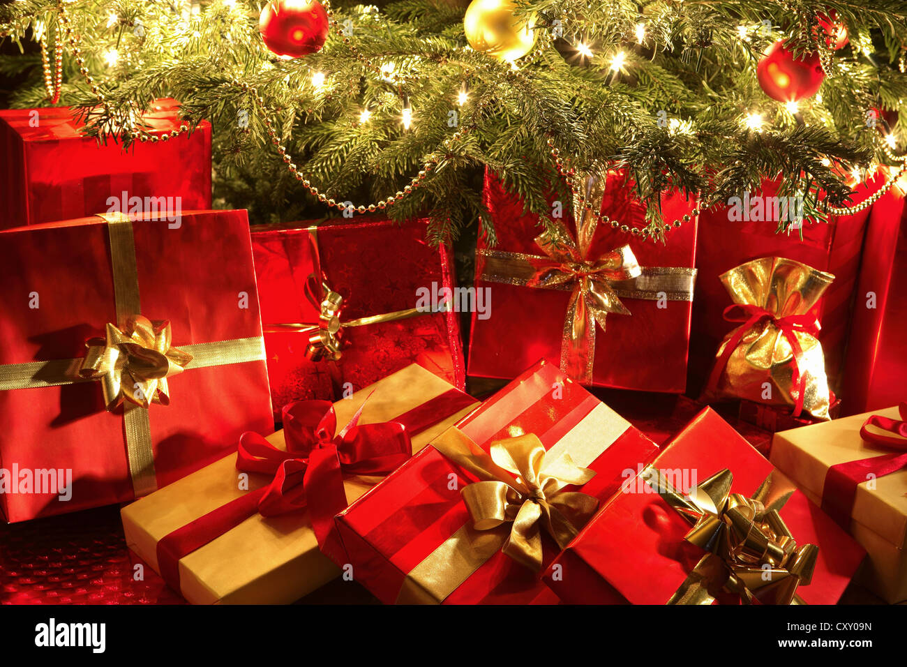 Christmas presents under a Christmas tree Stock Photo - Alamy