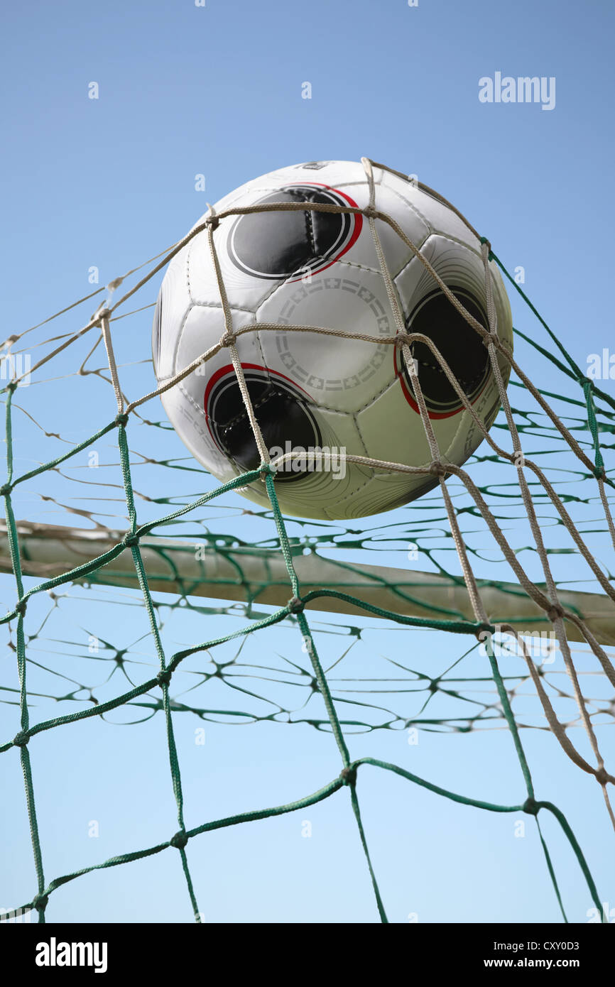 Goal, football caught in the net of a goal box Stock Photo - Alamy