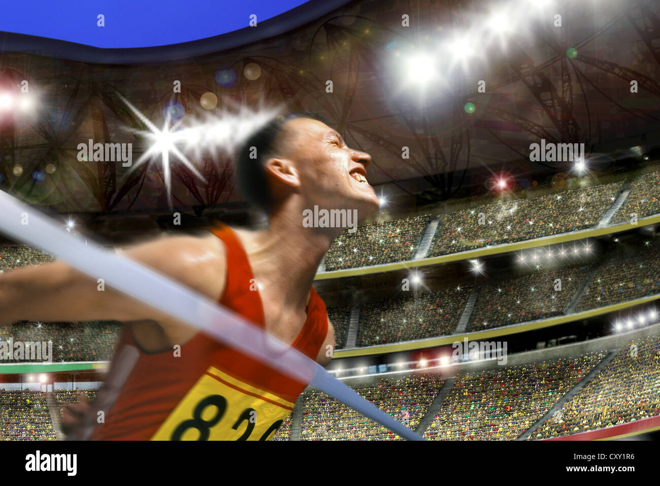 Runner, winner at the finish line just in front of the ribbon, stadium ...