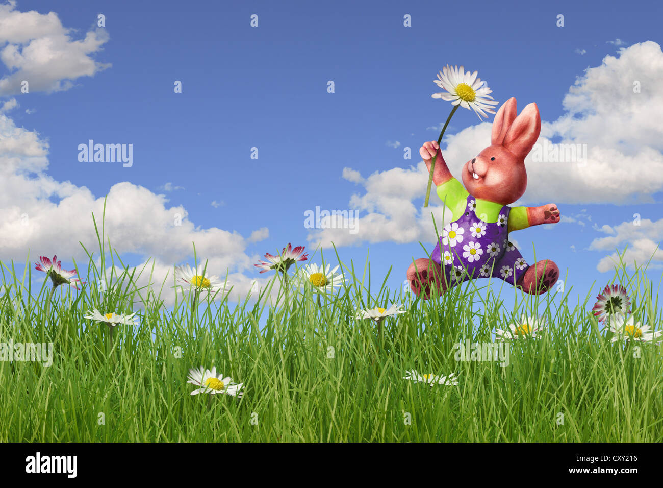 Easter bunny jumping in a meadow, illustration Stock Photo - Alamy