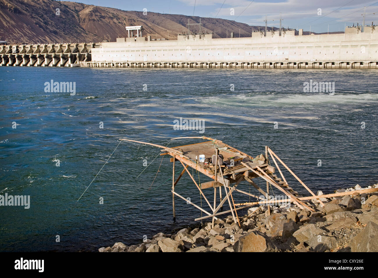 An Indian waits on a platform from which native american people fish ...