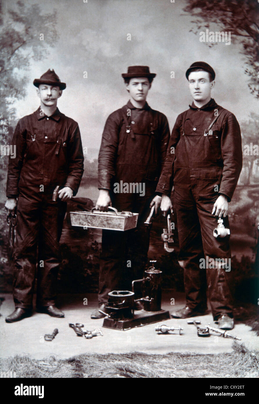Three Plumbers Holding Their Tools, Circa 1895 Stock Photo - Alamy