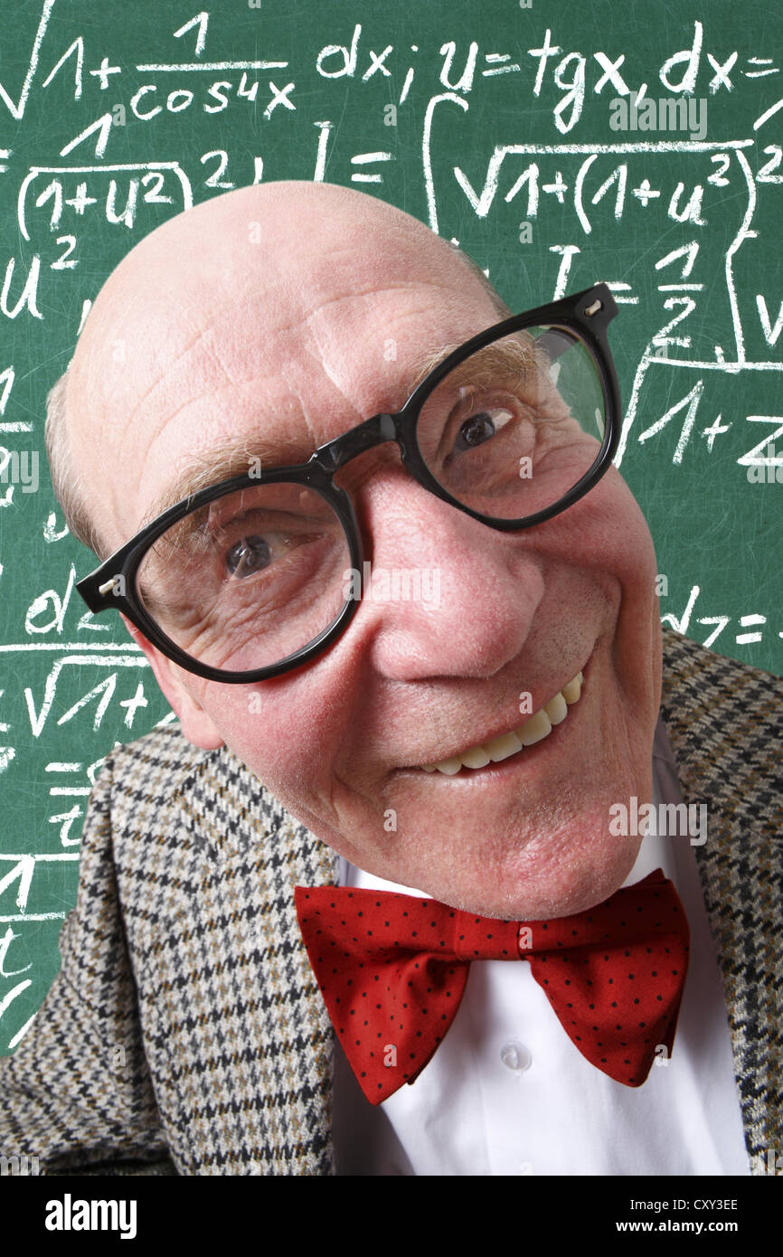 Professor, teacher, blackboard, mathematic formulas, equations ...