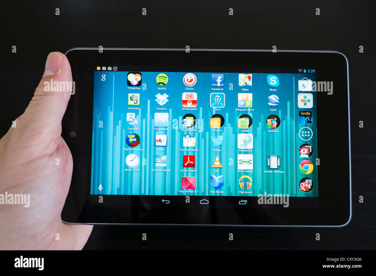 Man holding Google Nexus 7 tablet computer running android operating ...