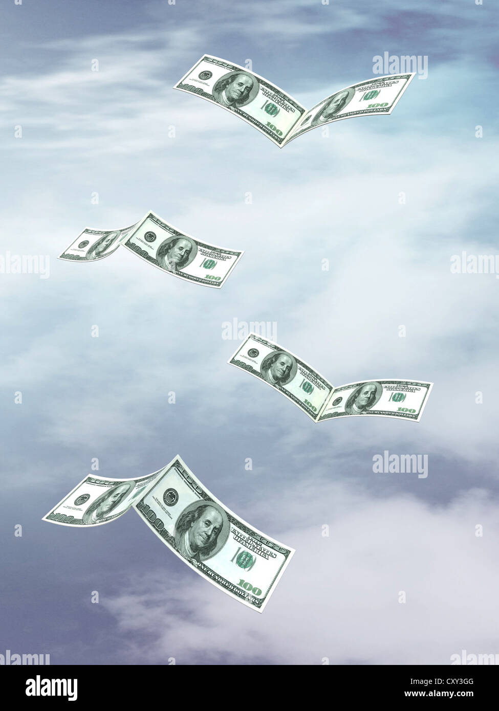 U.S. dollar banknotes that fly like birds, on sky background Stock ...