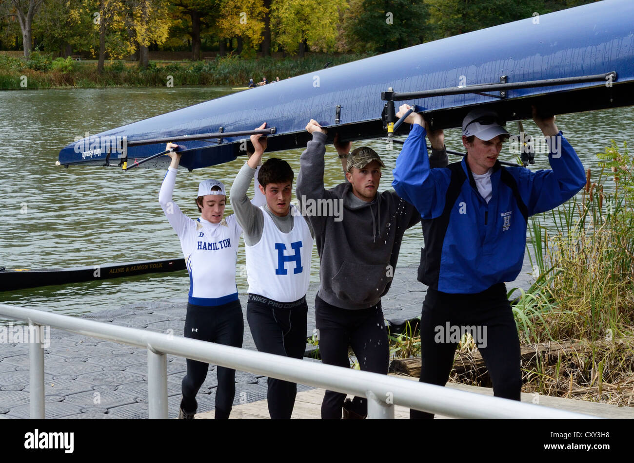 College students remove their sculling boat from regatta competition ...