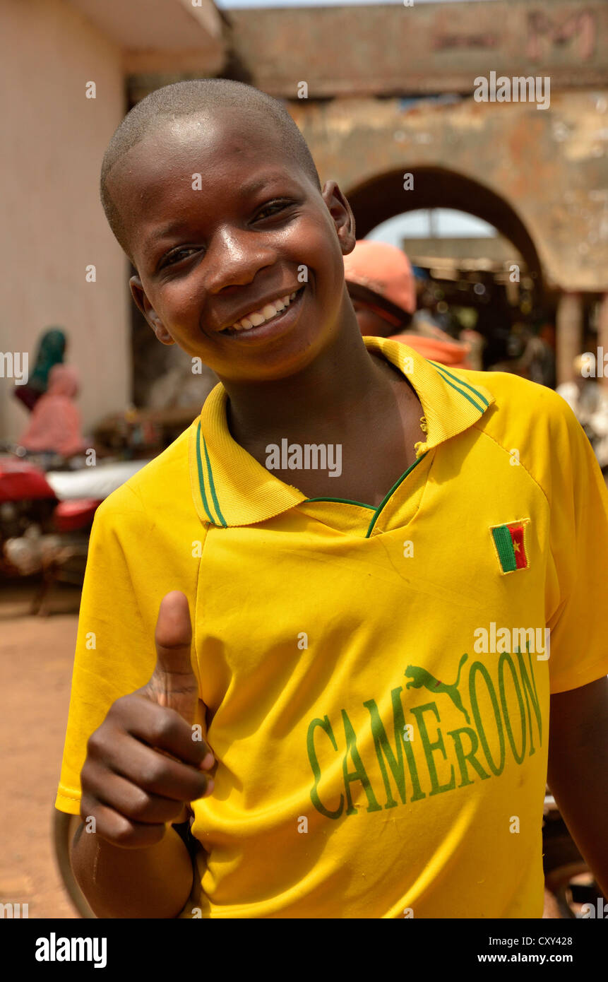 Boy in a Cameroon T-shirt making a thumbs up gesture, Ngaoundéré ...