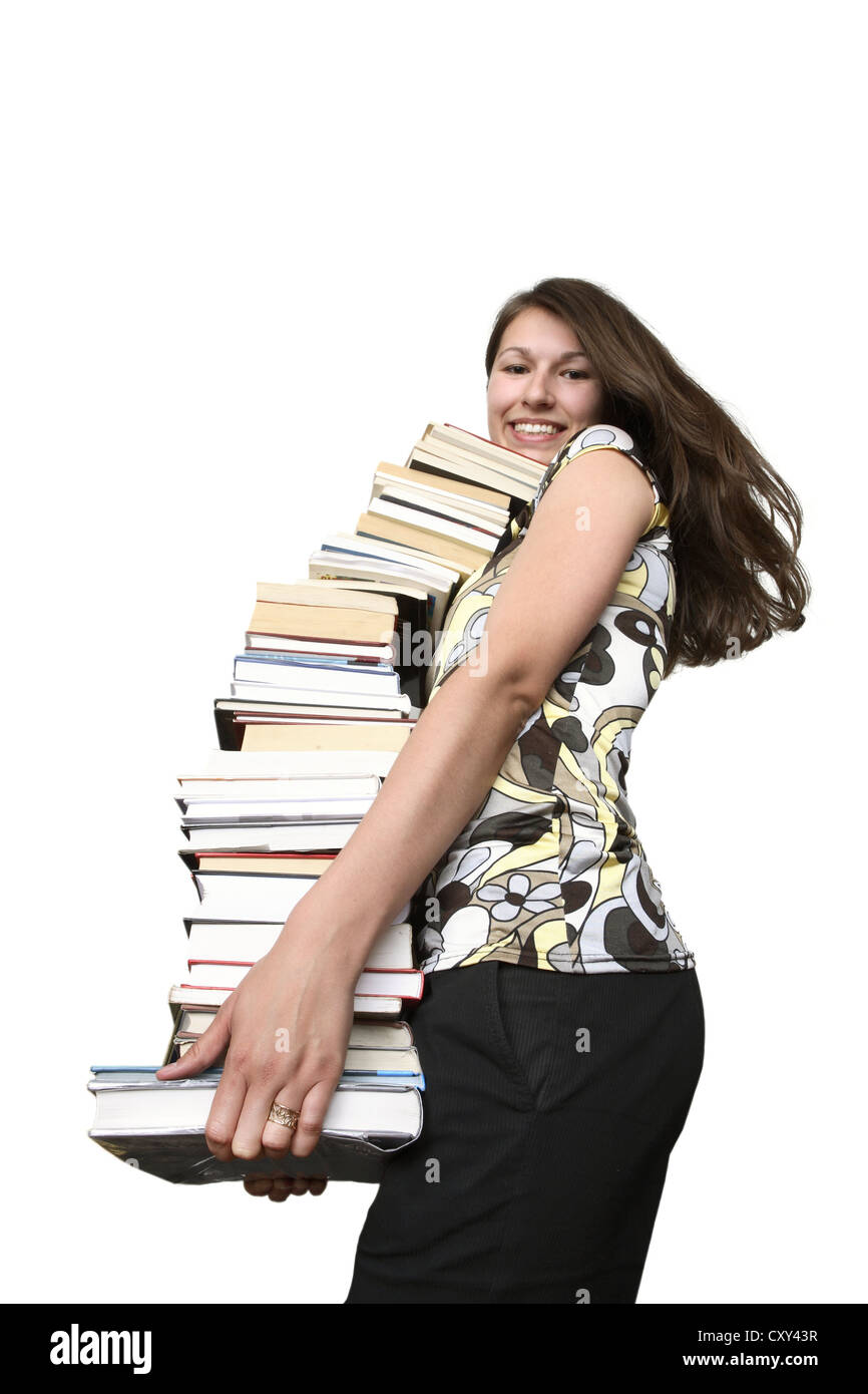 Student carrying a pile of books Stock Photo - Alamy