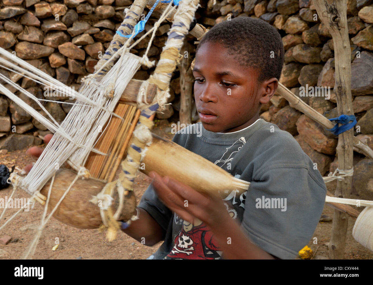 Boy working on a loom in the village of Rhumsiki, Cameroon, Central ...