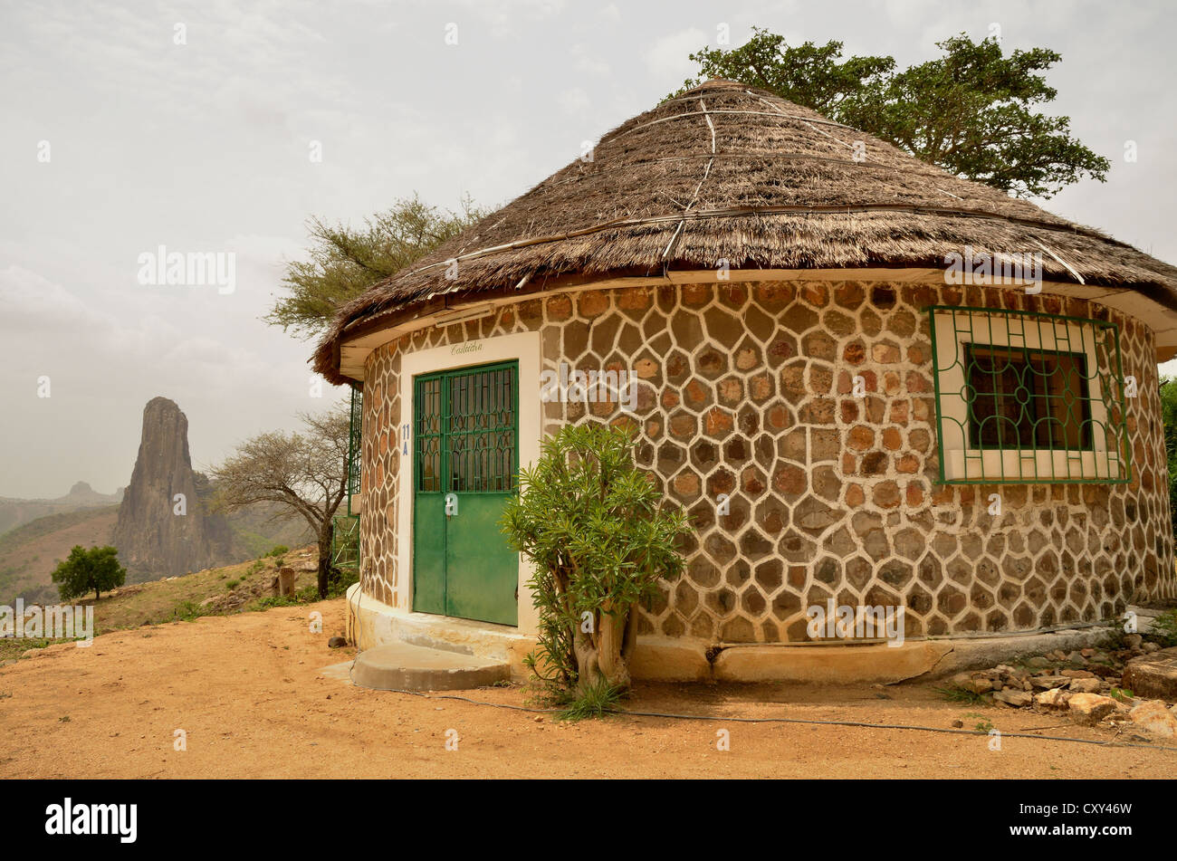 Round hut of the Campement de Rhumsiki, a hotel, volcanic landscape in ...