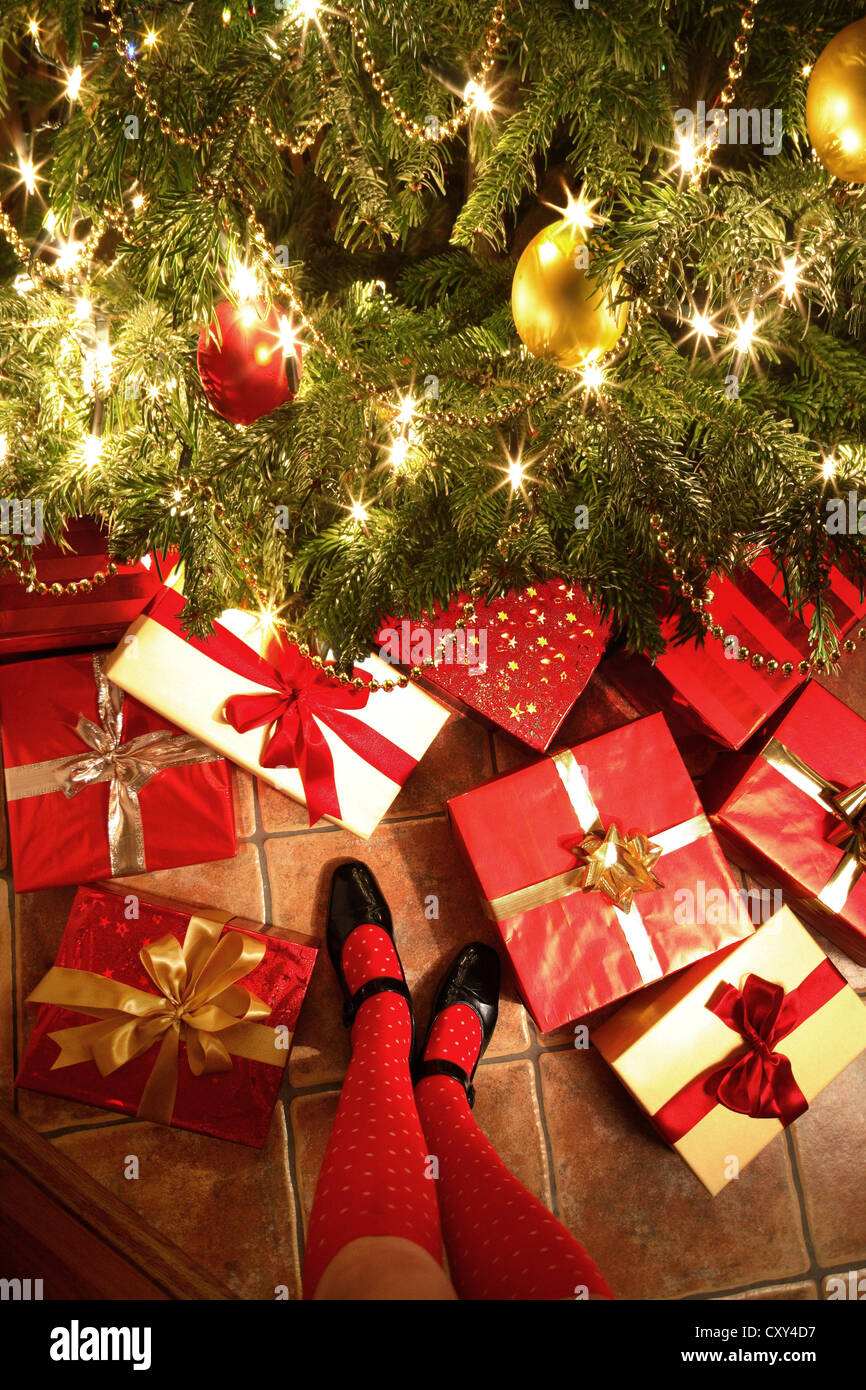 Christmas presents under tree legs hi-res stock photography and images ...