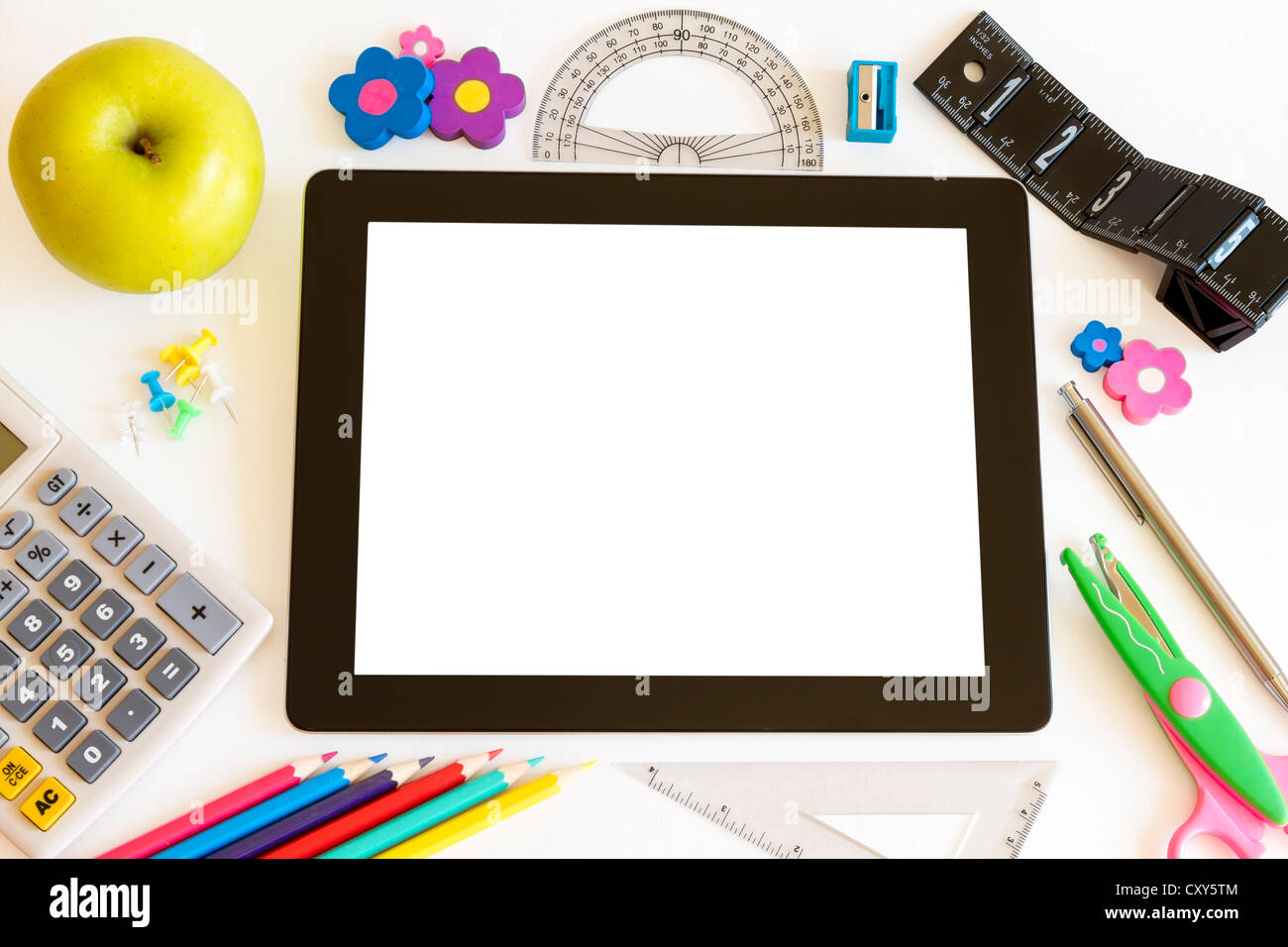 Tablet PC with school accesories on white background Stock Photo - Alamy