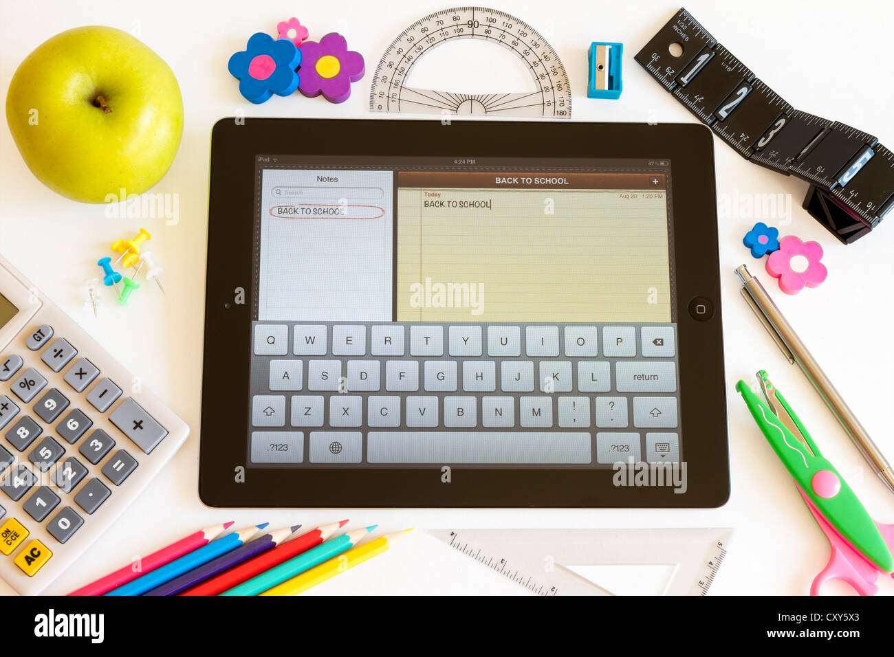 Ipad 3 with Notes application and school accesories on white Stock ...