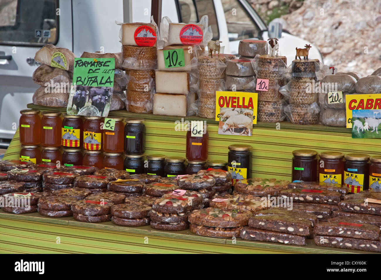 Cakes, honey and cheeses for sale on roadside stall, Spain Stock Photo ...