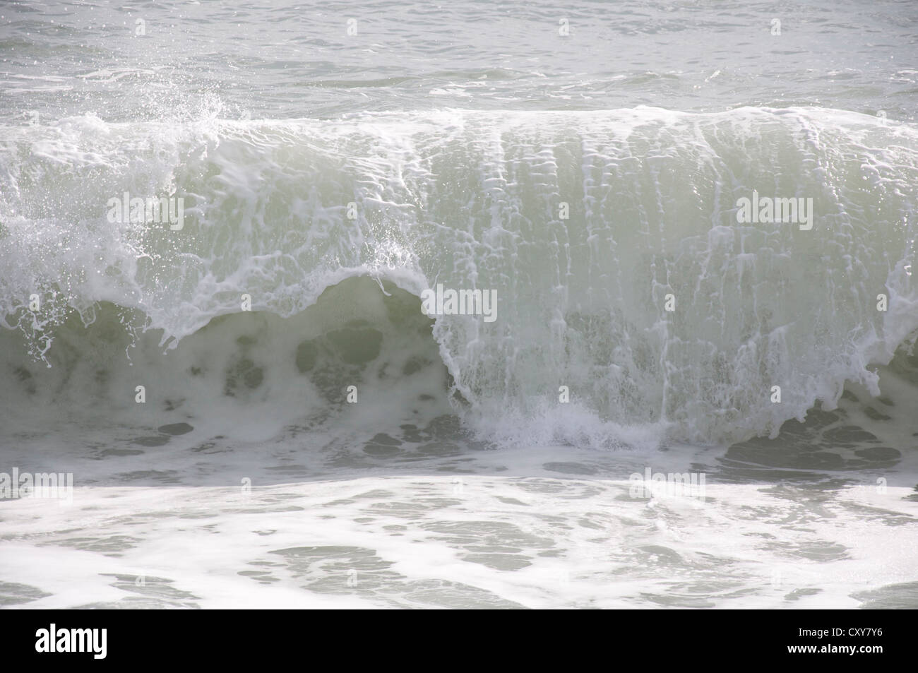 A big wave breaking upon Chesil Beach, on the Dorset coast, during ...