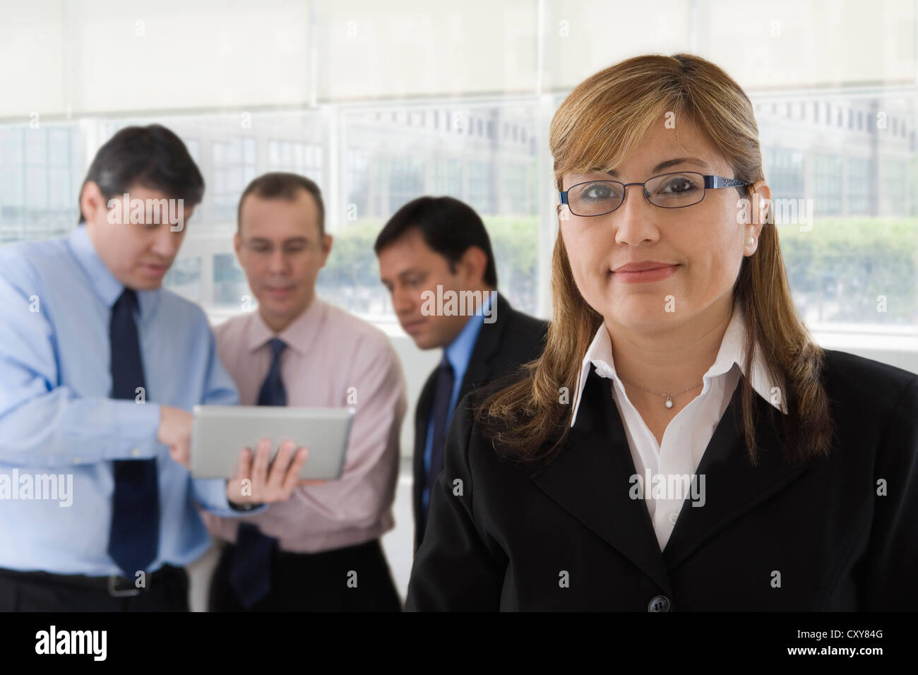 Hispanic business people working together Stock Photo - Alamy