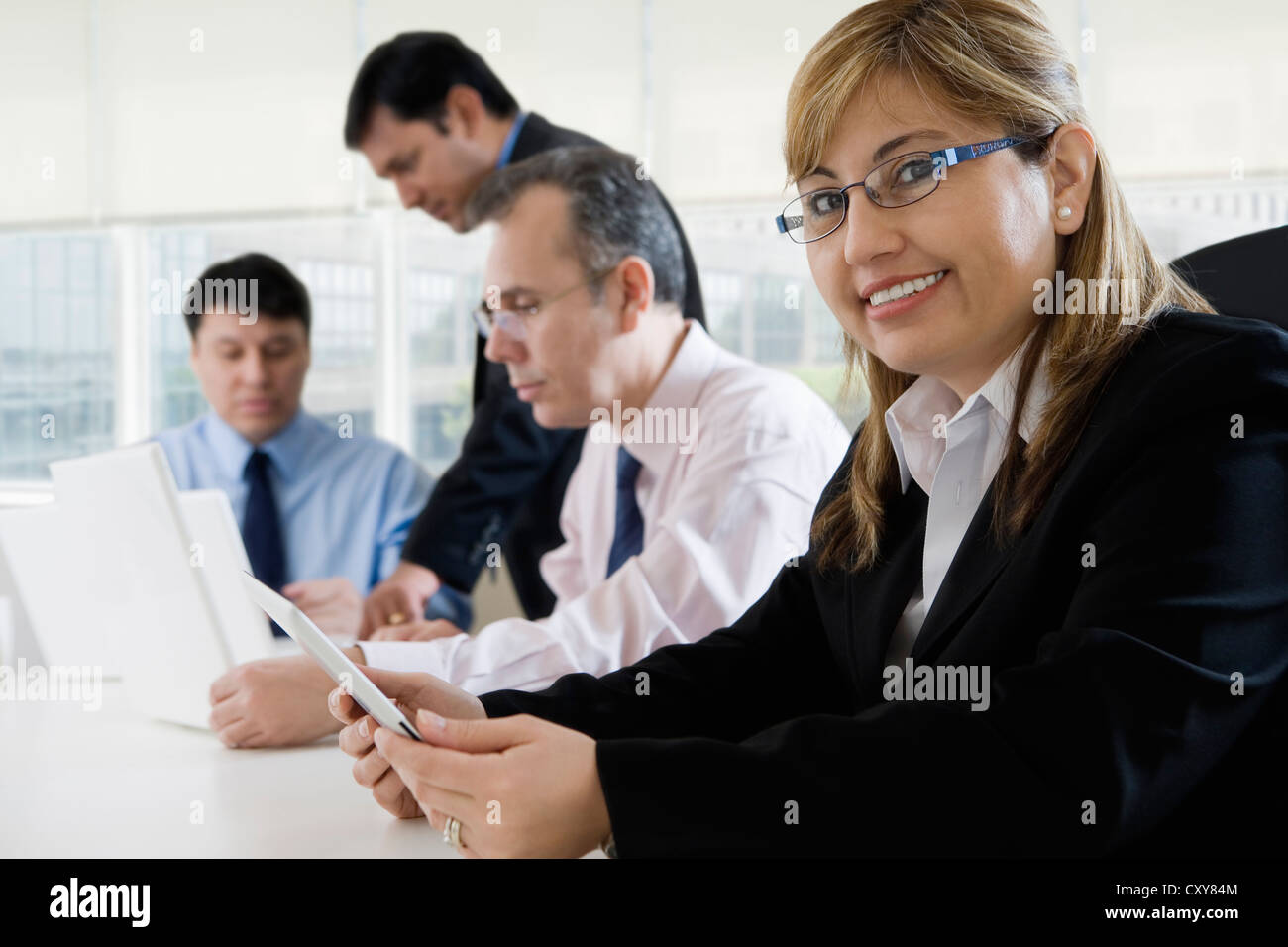 Hispanic business people working together Stock Photo - Alamy