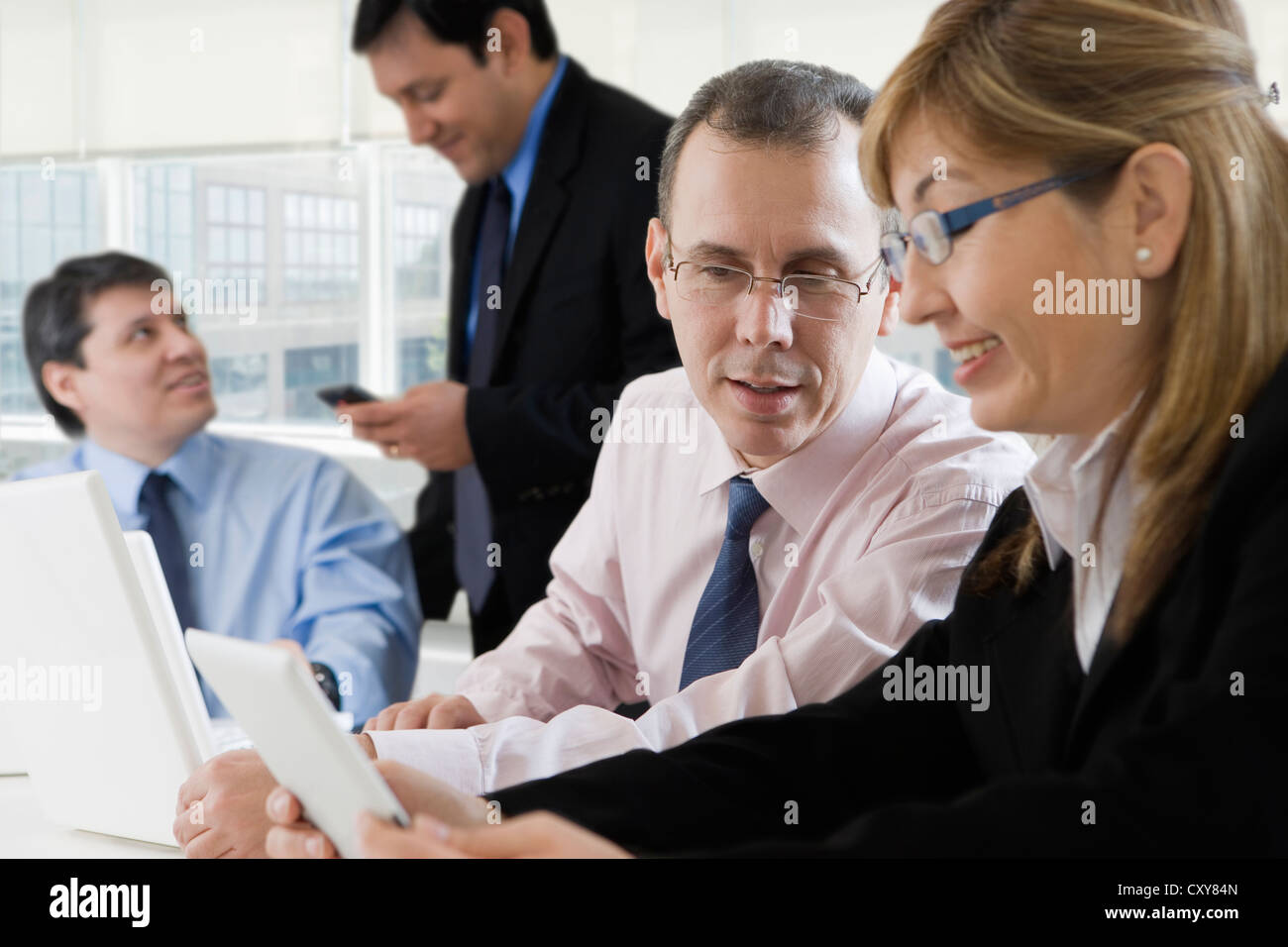 Hispanic business people working together Stock Photo - Alamy