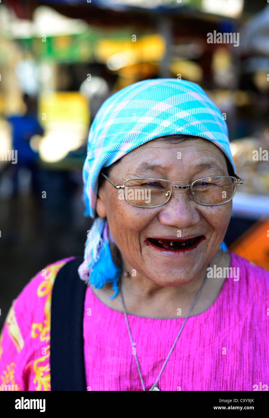 The Betel nut effect. An old Burmese woman with red teeth Stock Photo ...