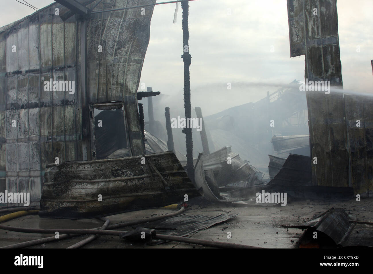 Water being sprayed on a fire scene of a roof collapse Stock Photo - Alamy