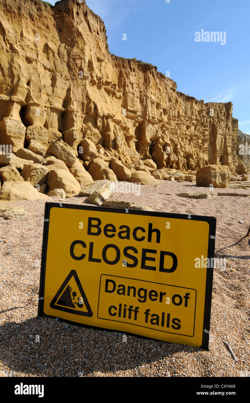 Beach closed signs, due to a fatality from cliff fall, at Burton ...