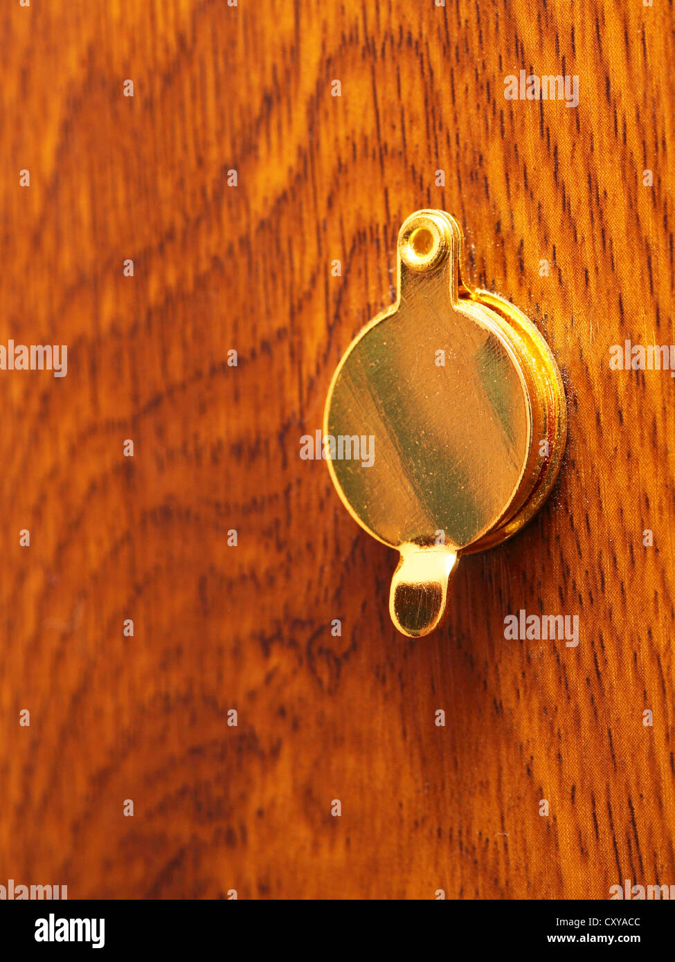 Peephole on wooden door Stock Photo - Alamy