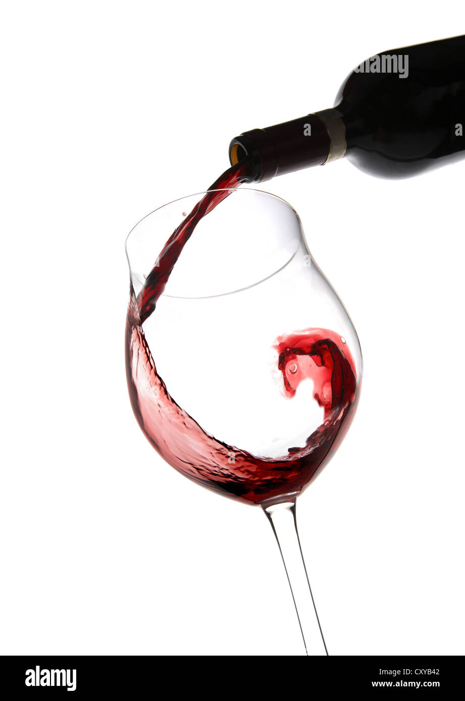 Red wine being poured into a red wine glass Stock Photo - Alamy