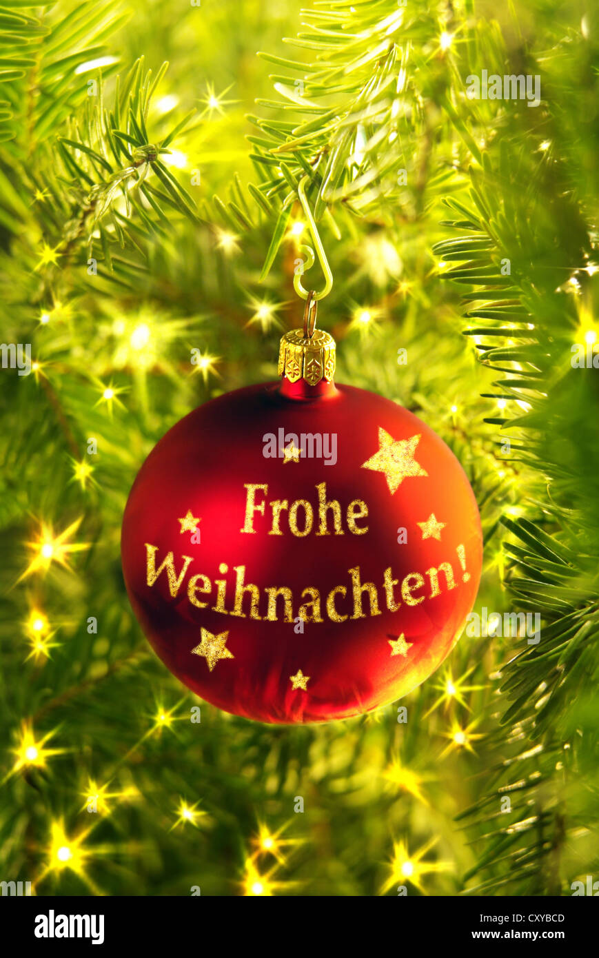 Red Christmas bauble with the message Frohe Weihnachten, German for ...