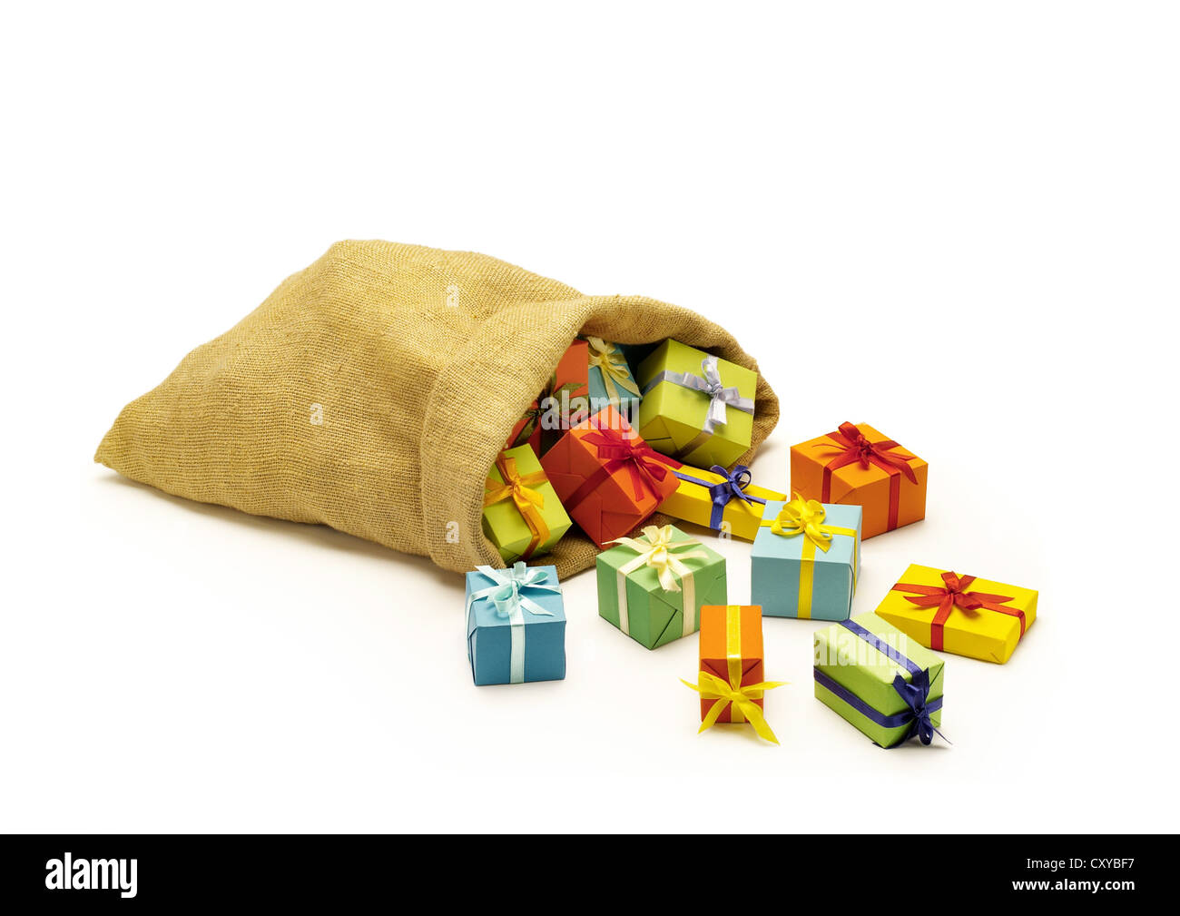 Colourfully rapped gifts in a jute bag Stock Photo - Alamy