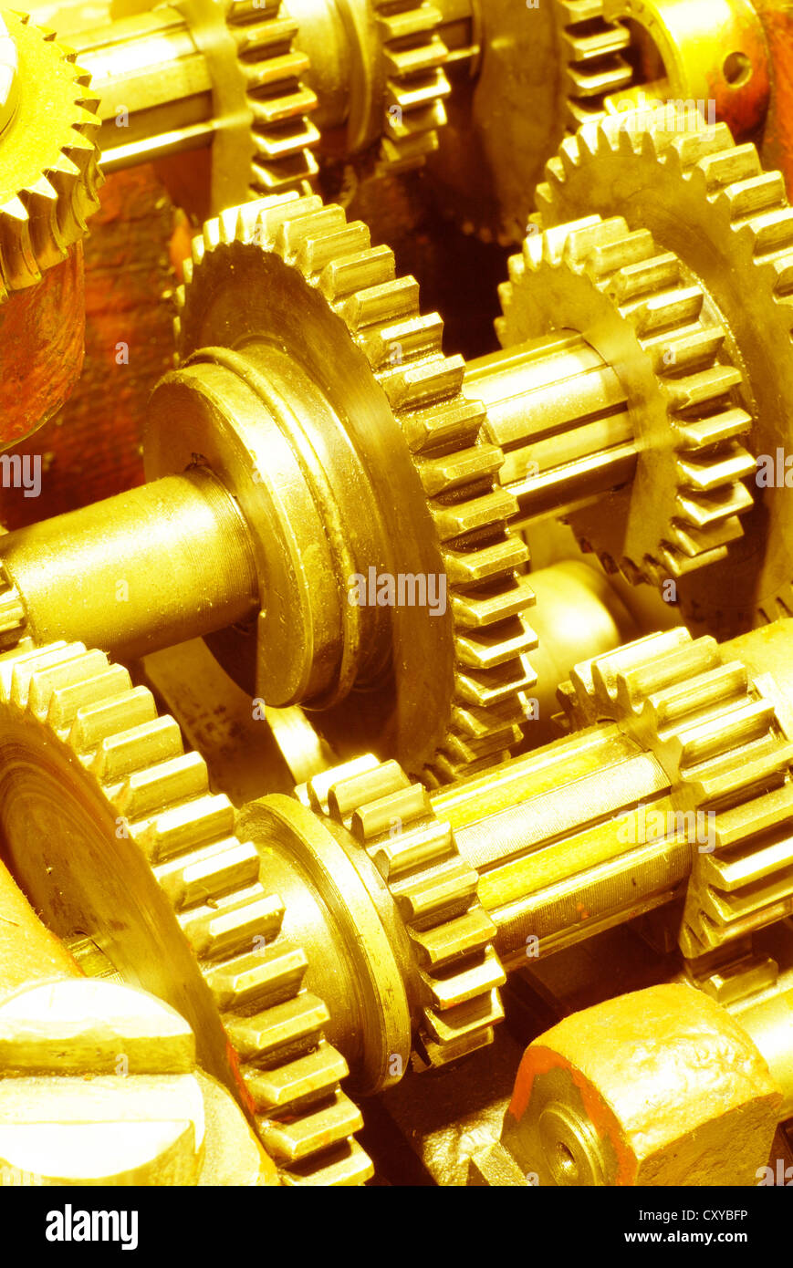 Golden cog wheels Stock Photo - Alamy