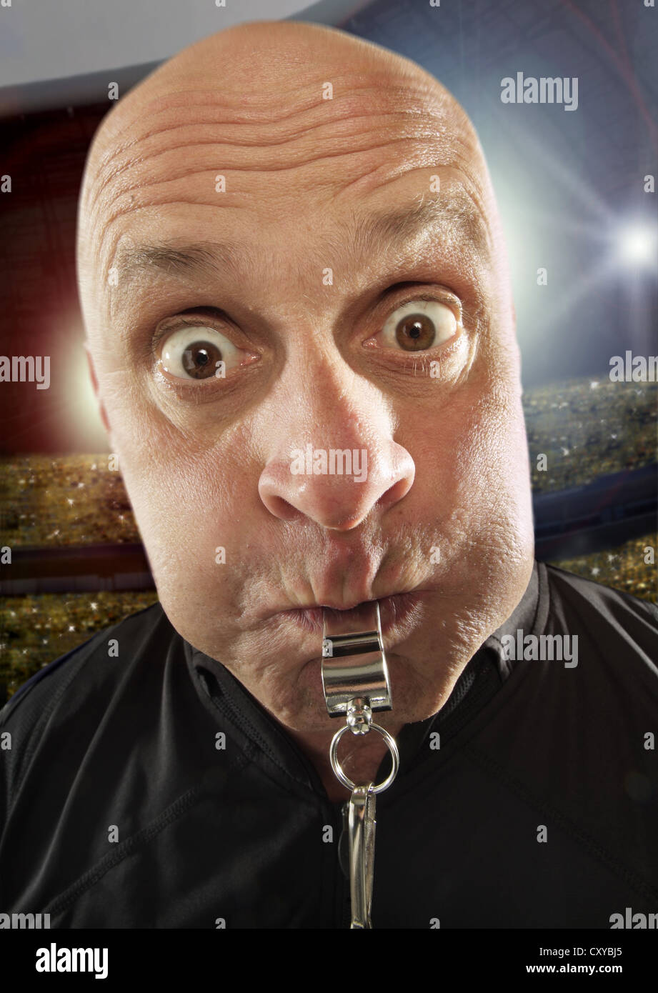 Referee blowing a whistle, energetic, portrait Stock Photo - Alamy