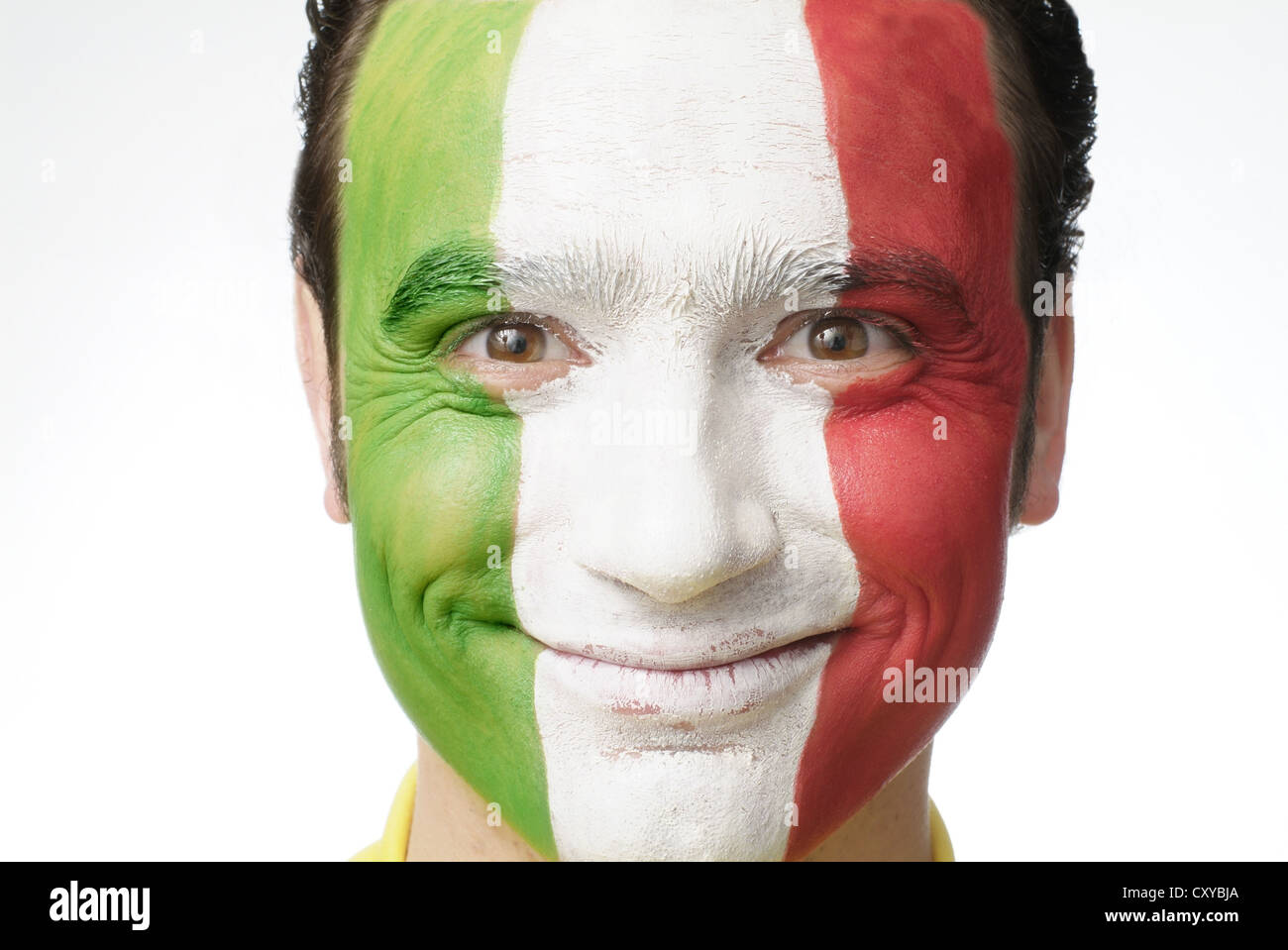 Football fan with his face painted in the national colours of Italy ...