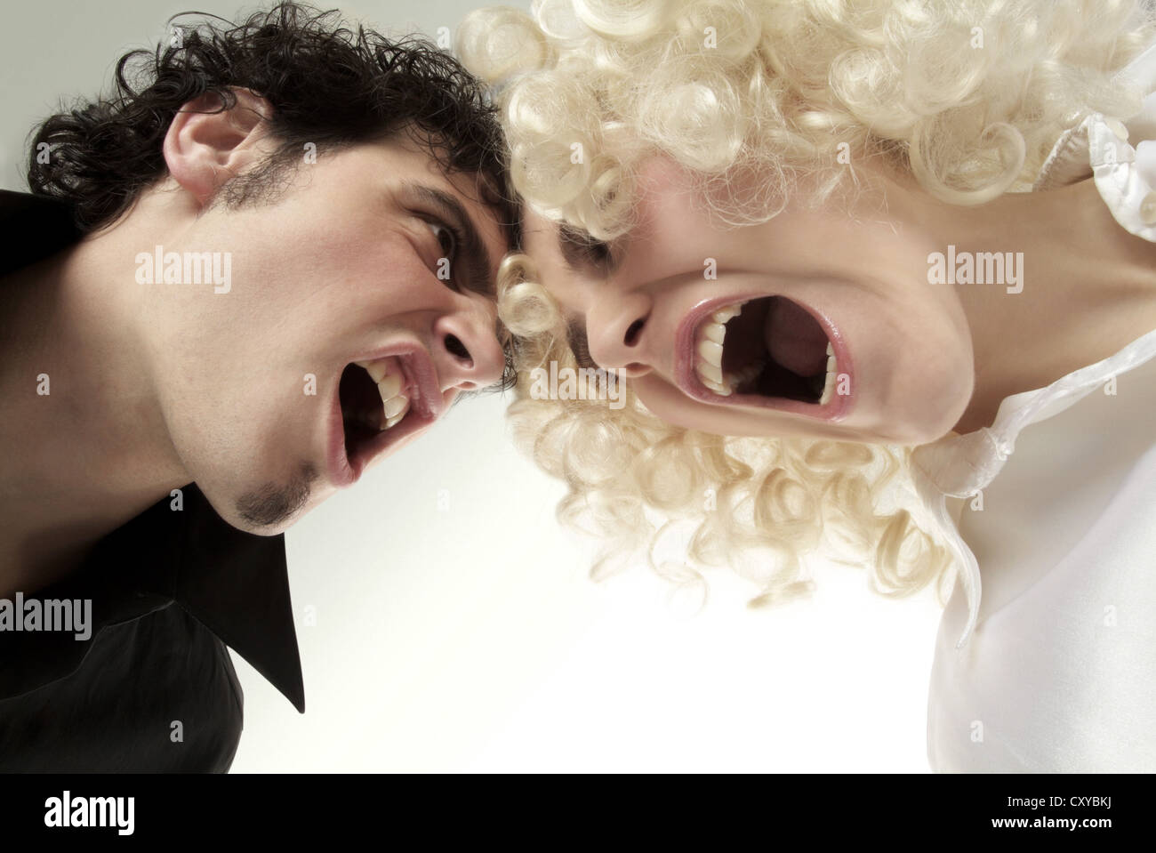 Young couple, face to face, screaming at each other Stock Photo - Alamy