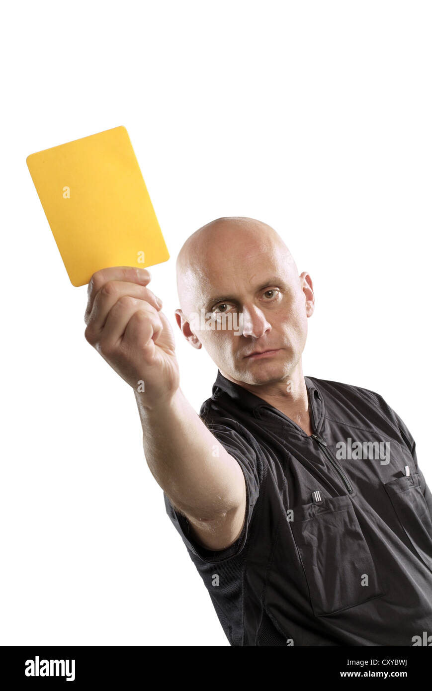Referee holding a yellow card Stock Photo - Alamy